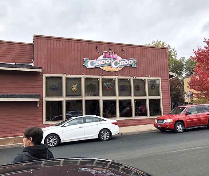 The pink and brown exterior might not scream "train station," but that charming sign promises locomotive fun inside.