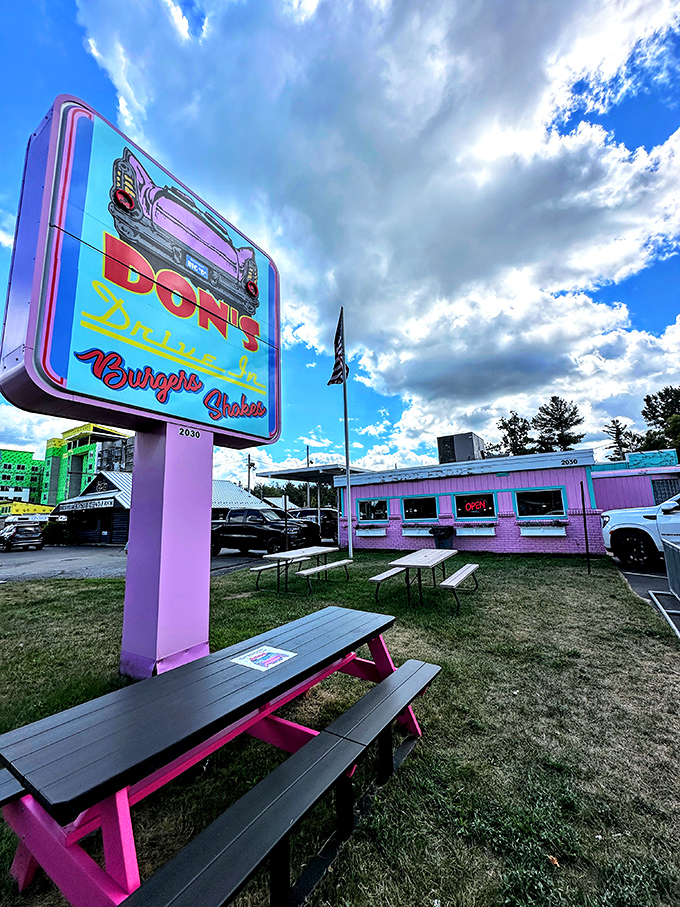 Don's Drive-In's cotton candy pink exterior and vintage sign create the perfect backdrop for summer memories and classic burgers.