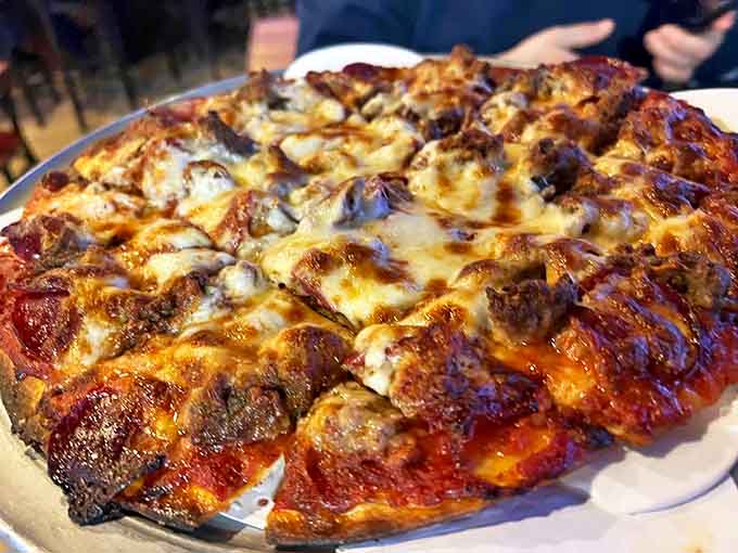 The three-meat pizza showcases Bartolini's perfect thin crust &ndash; sturdy enough for serious toppings but delicate enough to let flavors shine.