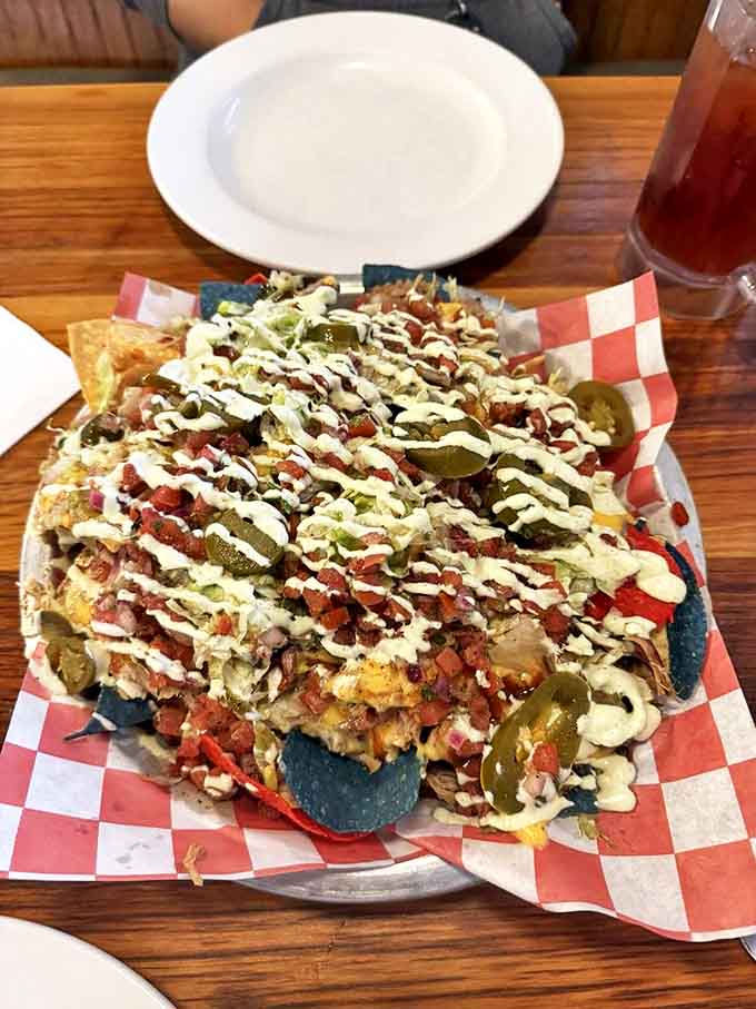 These Adobo Pork Nachos aren't just topped – they're architecturally engineered to ensure every chip gets its fair share of smoky, tangy goodness.