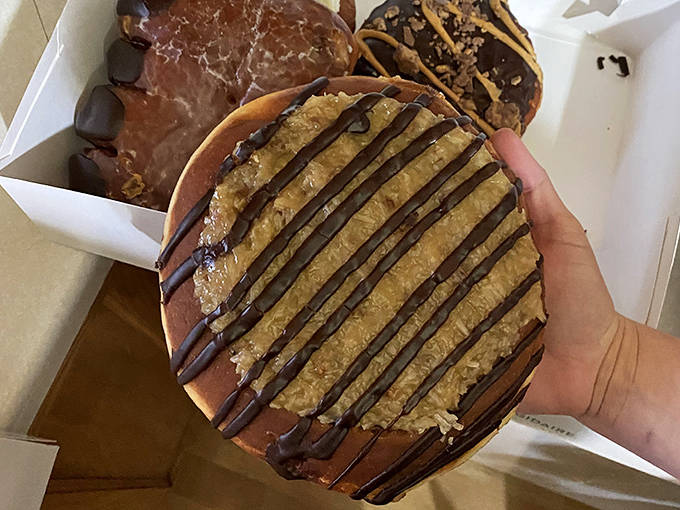 This isn't just a donut, it's an engineering marvel of fried dough and chocolate drizzle that makes regular pastries look like diet food.