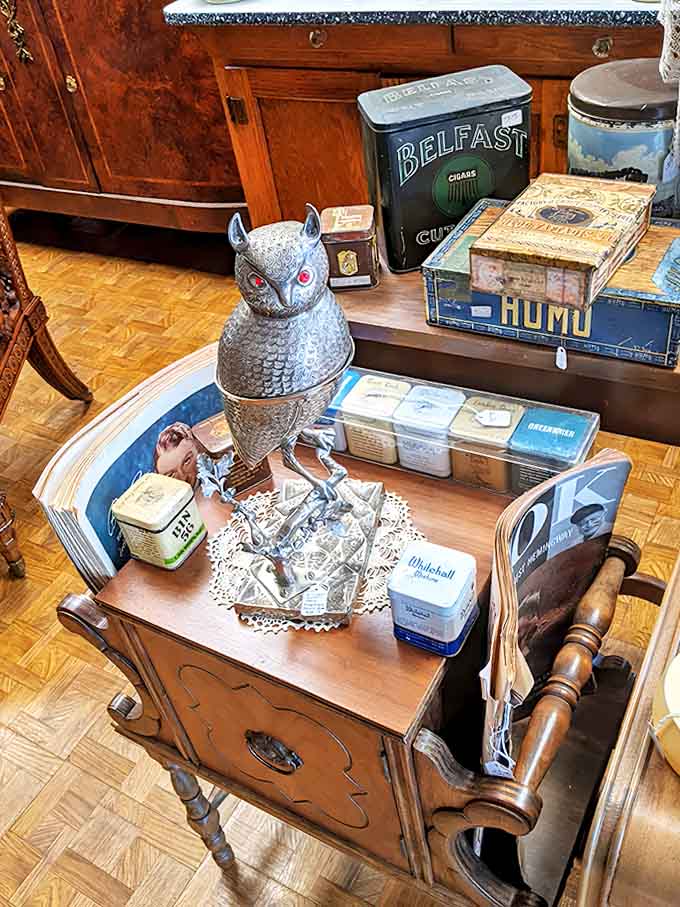 This silver owl isn't just watching you shop – with its gleaming metal feathers and ruby-red eyes, it's practically demanding to come home with you.