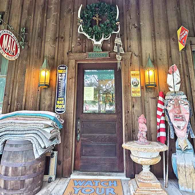 The shop's entrance serves as a portal to the past, with weathered wood, vintage signage, and folk art guardians welcoming curious time travelers.