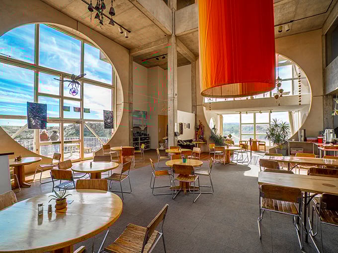 The caf&eacute; offers more than just meals &ndash; it serves up panoramic desert views through those signature circular windows.