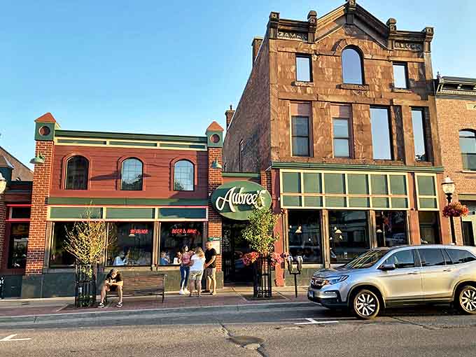 Aubree's outdoor seating offers front-row tickets to Marquette's daily parade of characters against historic brick backdrops.