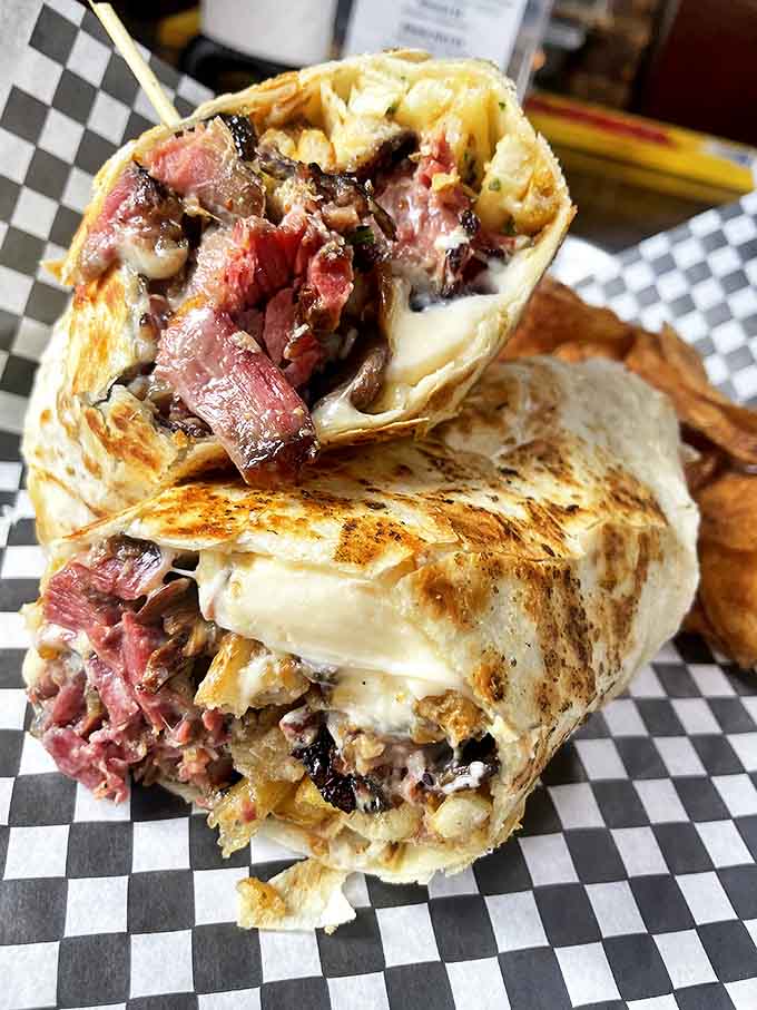 The BBQ burrito&mdash;a cross-cultural masterpiece where tender brisket, melted cheese, and caramelized onions find harmony in a grilled tortilla embrace.
