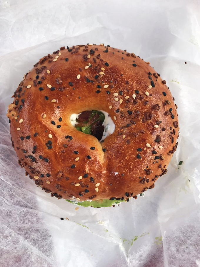This isn't just any bagel &ndash; it's the perfect vehicle for creamy avocado, a nod to those who occasionally need a break from sugar-induced euphoria.