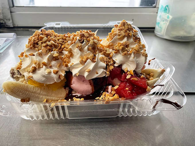 This banana split is an engineering marvel of ice cream architecture, piled high with enough toppings to make you question your ambition (but you'll finish it anyway).