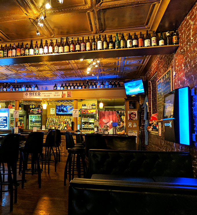 The bar's vintage tin ceiling and exposed brick walls create the perfect backdrop for an impressive collection of spirits and taps.