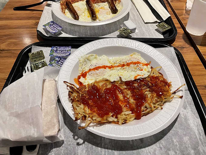 Breakfast done right &ndash; golden eggs alongside crispy hash browns that somehow manage to be both crisp and tender in perfect harmony.