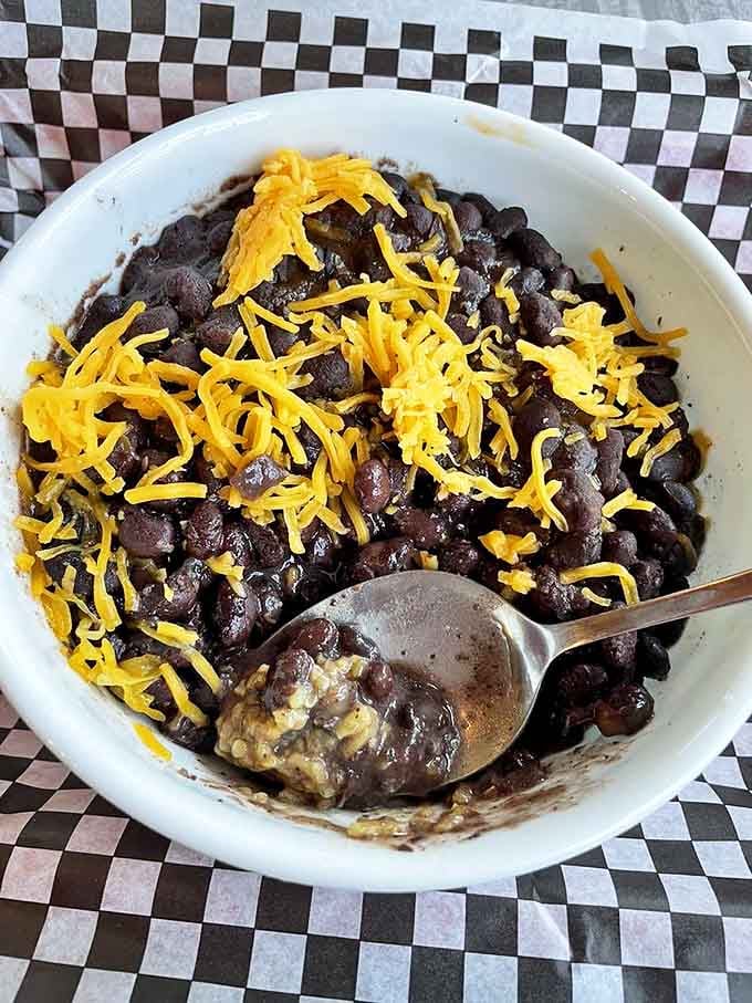 Black beans topped with cheese might seem simple, but when they're cooked right, simple becomes sublime.