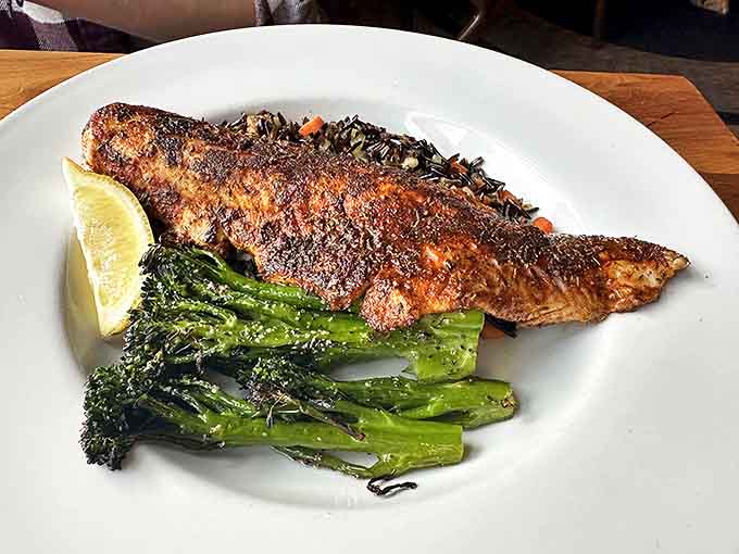 Lake-to-plate perfection! Blackened fish with vibrant broccolini and a lemon wedge creates a harmony of flavors that sings of the Northwoods.