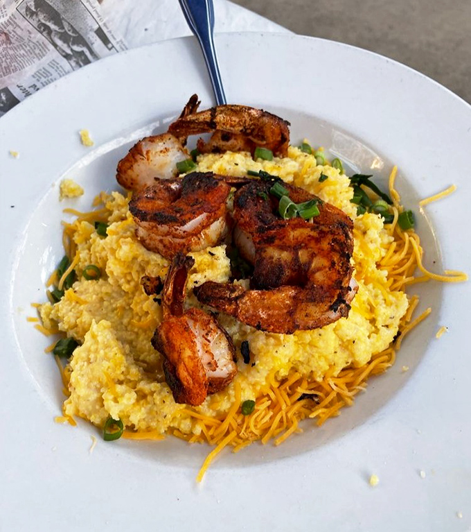 Blackened shrimp nestled on cheesy grits &ndash; a Southern classic that proves Florida and New England can coexist deliciously.