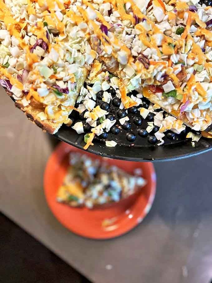 The Boom pizza celebrates seafood with succulent shrimp, sweet peppers, and red onion on a perfectly baked crust.