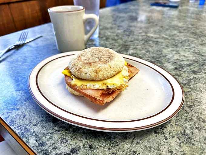 Breakfast sandwich perfection &ndash; where the humble English muffin meets its destiny with melty cheese and a perfectly cooked egg.