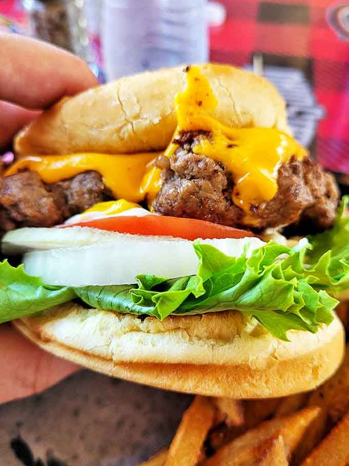 This isn't just a cheeseburger; it's a masterpiece of melty cheese cascading over a hand-formed patty that demands to be photographed.