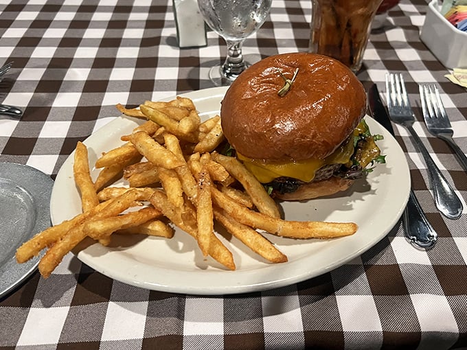 The Winston Burger arrives on a perfectly toasted bun with golden fries so crisp they practically shatter &ndash; comfort food elevated to art form.