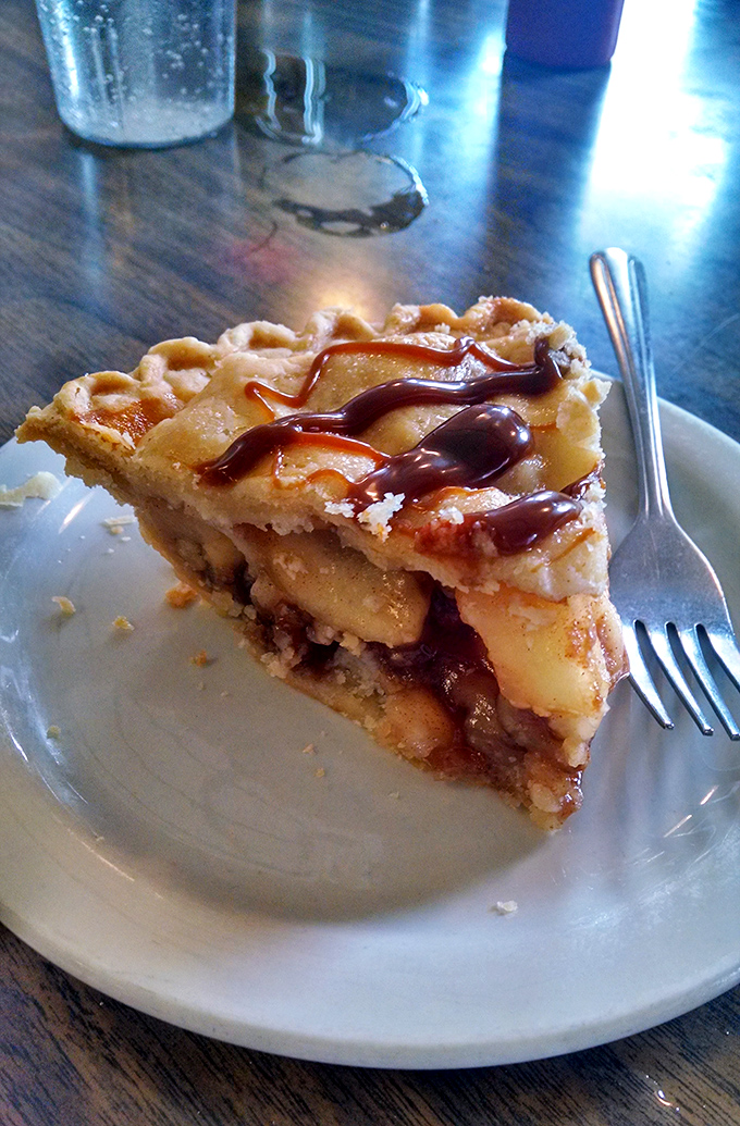 Caramel apple pie that makes you want to high-five autumn &ndash; sweet apples swimming in buttery caramel beneath a perfectly flaky crust.