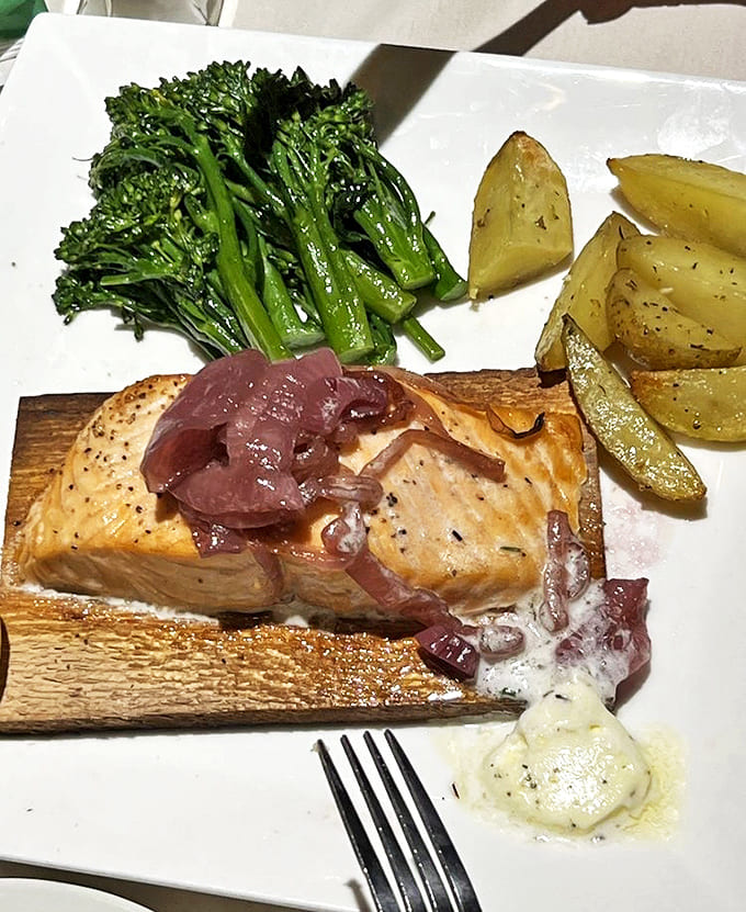 Cedar plank salmon that tastes like it was caught by a medieval fisherman with exceptionally good taste and access to modern culinary techniques.