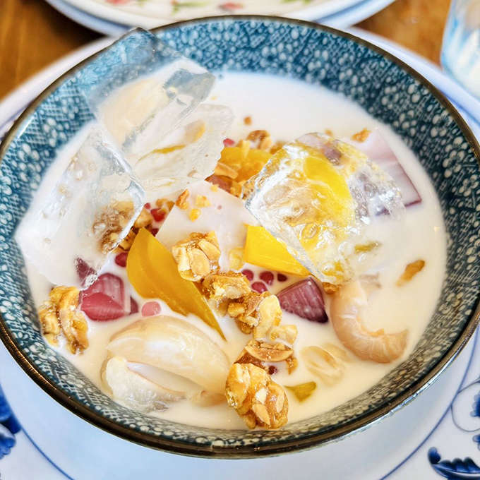 This dreamy coconut milk dessert with tropical fruits looks like it's wearing jewelry&mdash;those translucent jellies catch light like culinary gemstones.