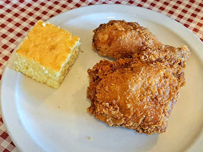 Simple pleasures done right &ndash; golden cornbread alongside perfectly fried chicken creates a duo that sings in perfect harmony.