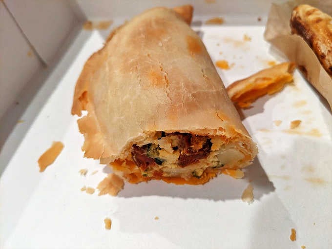 The Chorizo Empanada is what happens when breakfast decides to get portable and delicious, solving the age-old problem of eating eggs while walking.