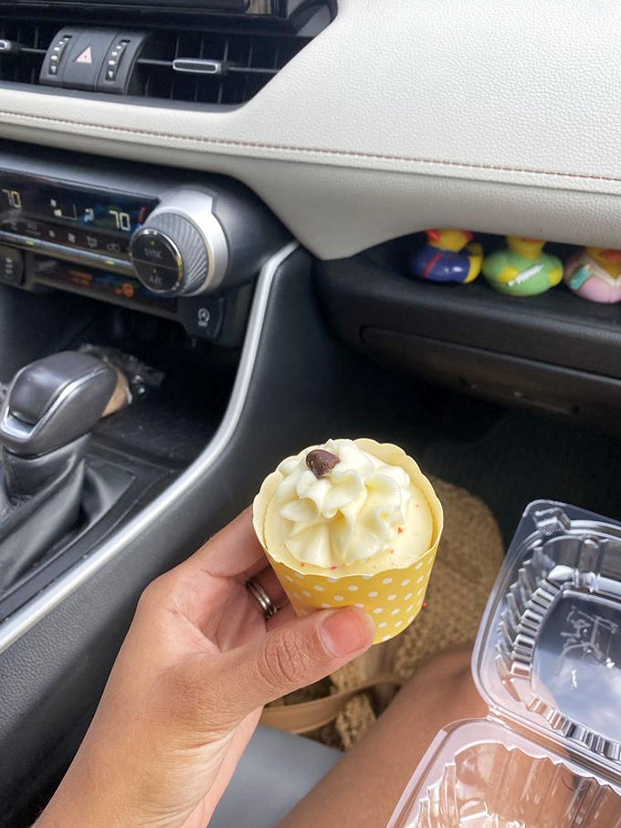 A mini red velvet cheesecake being enjoyed in the car &ndash; because sometimes waiting until you get home is simply asking too much of human willpower.