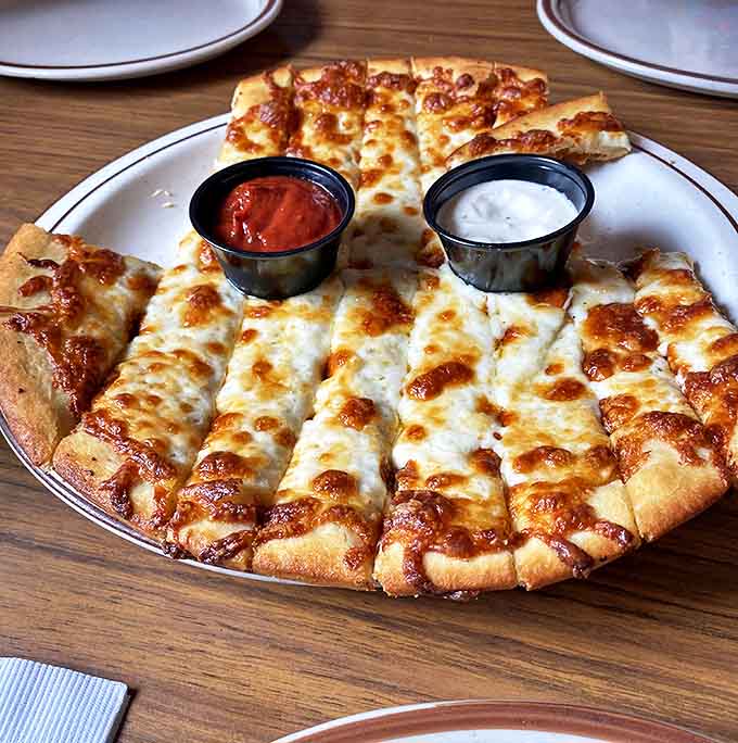 Garlic fingers &ndash; the appetizer that's almost impossible to share. Buttery, cheesy, and perfect for dipping in marinara or ranch.