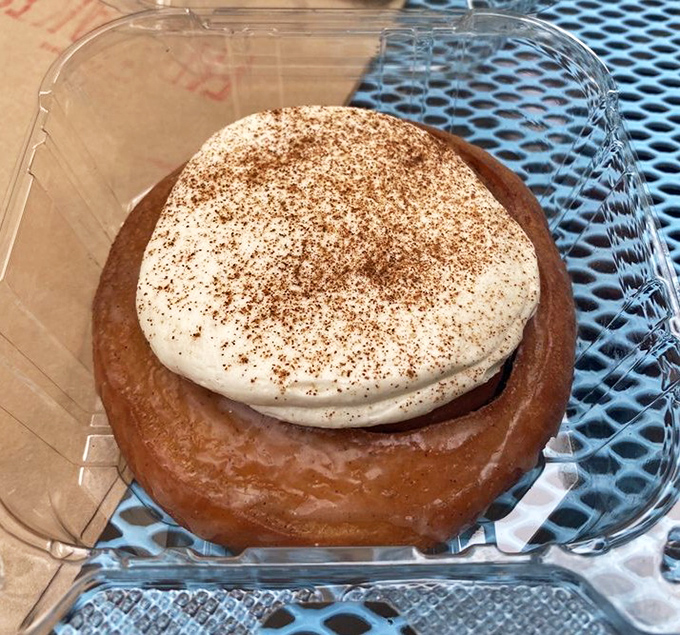 Cinnamon roll meets donut in this swirled sensation, where cream cheese frosting melts slightly into the warm spiced dough beneath.