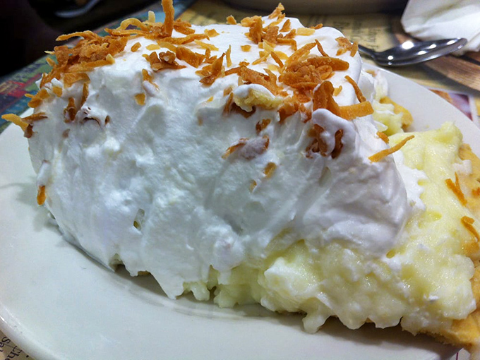 Coconut cream pie that defies gravity! Towering meringue topped with toasted coconut shreds creates a dessert that's as beautiful as it is delicious.