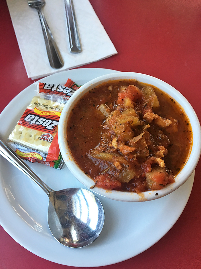 Conch chowder that warms the soul &ndash; a tomato-based treasure hunt where each spoonful reveals tender conch and vegetables in a rich, flavorful broth.