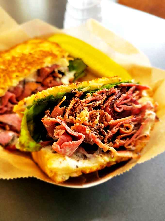 Corned Beef or Pastrami: Why choose when you can have both? This sandwich doesn't understand the concept of "too much meat."