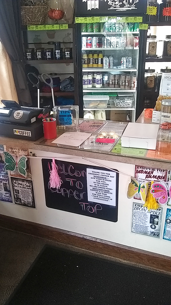 The welcoming counter, plastered with community notices and colorful signs, serves as mission control for all your pastry-related needs.