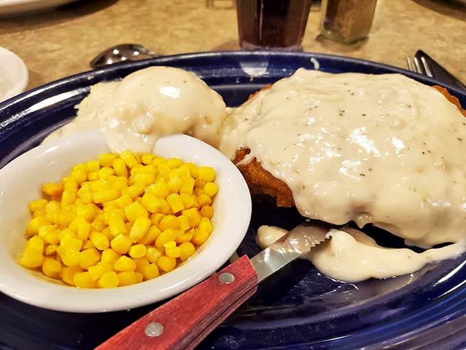 Country-fried steak swimming in creamy gravy with sweet corn on the side &ndash; a Midwest breakfast symphony that plays directly to your soul.