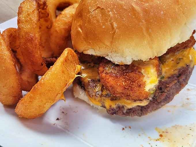The Cowboy Burger arrives with its posse of onion rings – a flavor showdown where everybody wins, especially your taste buds.