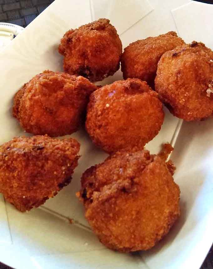 Golden-brown Cowboy Bites emerge from the fryer crispy on the outside, revealing a cheesy, potato-filled interior that locals crave.