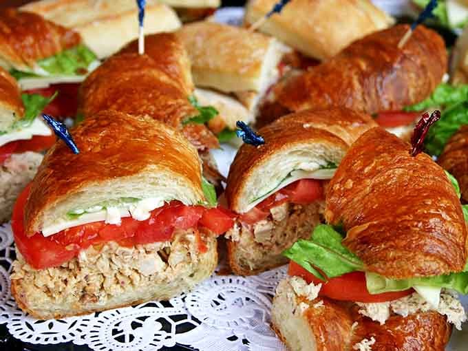 Buttery croissants playing dress-up as sandwiches, stuffed with fresh ingredients that would make any Parisian nod in approval.