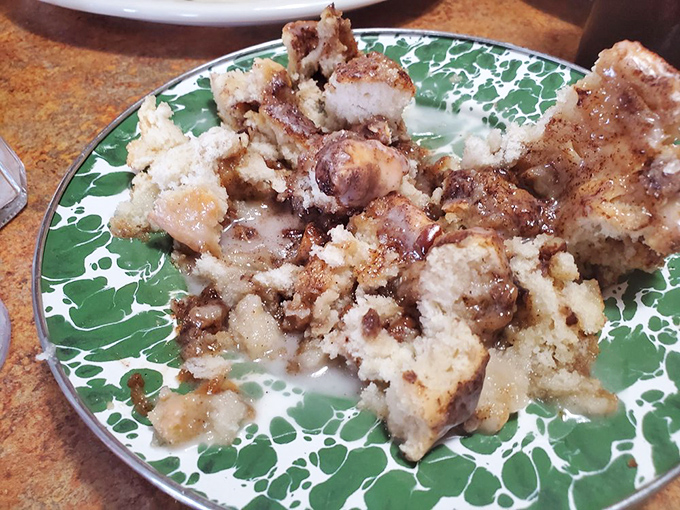 What happens when cinnamon roll meets fork – a beautiful destruction that reveals layers of buttery, spiced perfection waiting to be devoured.