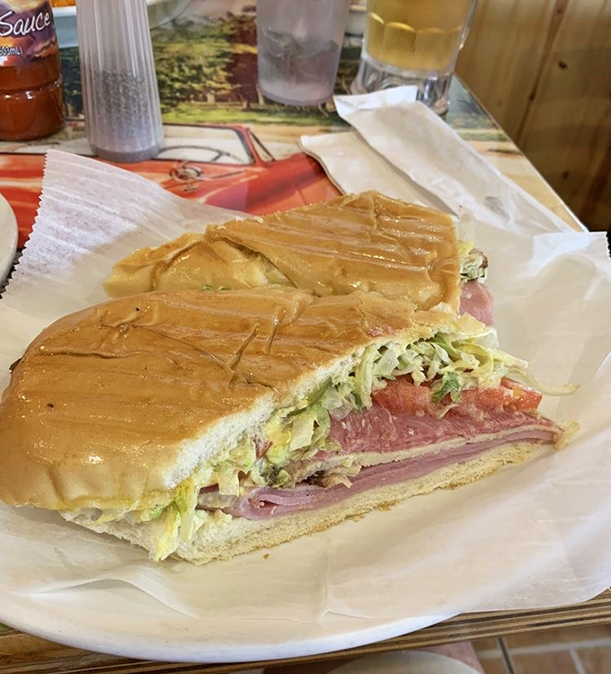 Layers of ham, roasted pork, and pickles create the holy trinity of Cuban sandwich perfection &ndash; no cheese needed when the basics are this good.