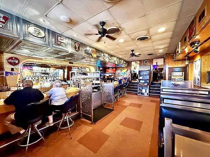 The bar area at Buddy's serves as a community gathering spot where strangers become friends over Detroit's most famous export (after cars).