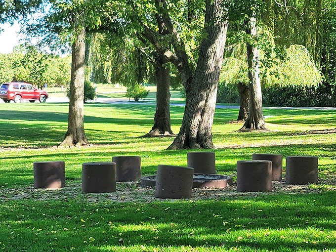 David Carroll Memorial Citizens Park provides a peaceful retreat with its circle of stone seats, perfect for community gatherings under ancient shade trees.