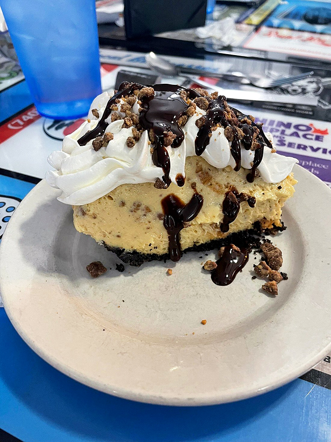 Peanut butter pie with an Oreo crust that makes you question every dessert decision you've ever made before this moment.