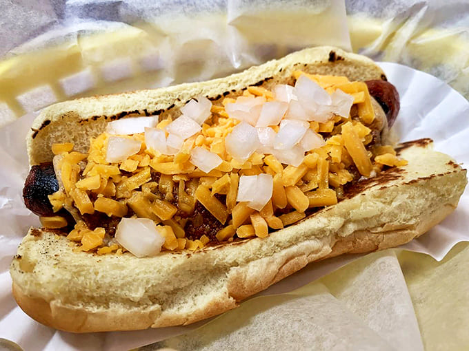 The "Dixie" struts its stuff with chili sauce, diced onions, and sharp cheddar &ndash; a showstopper that proves hot dogs can indeed be gourmet affairs.