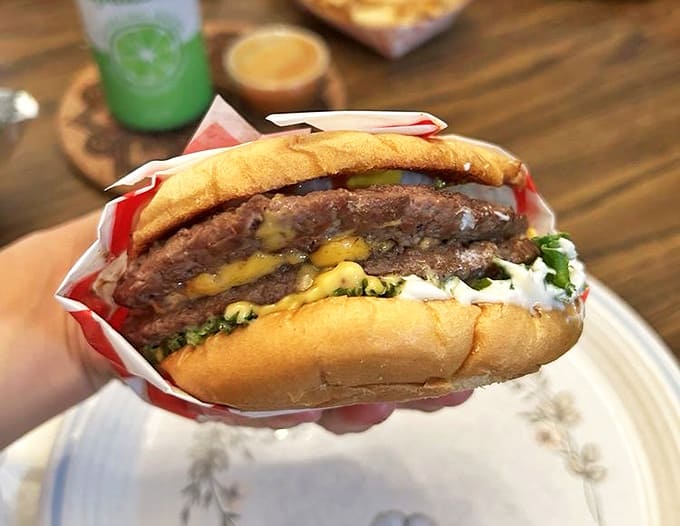 Double Hamburger: Two substantial patties nestled between a soft bun with fresh toppings &ndash; proof that sometimes more really is more.