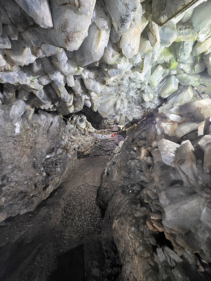 Mind your head! This narrow passage requires a duck of the noggin, but the crystalline reward waiting beyond is worth the momentary crouch.
