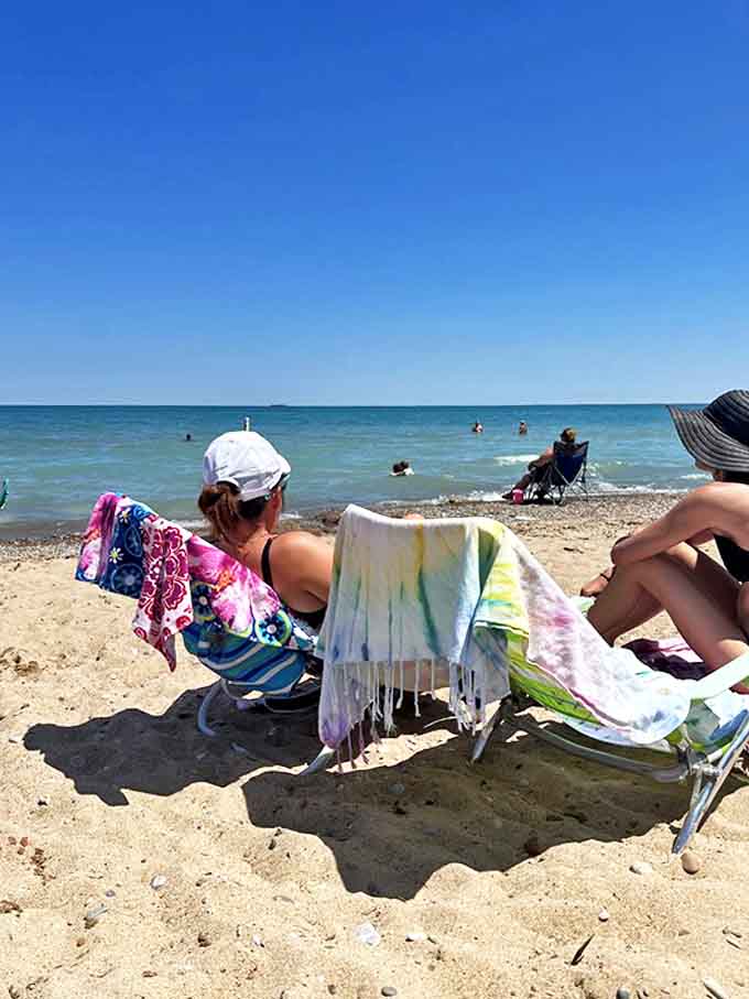 Beach chairs, colorful towels, and not a care in the world &ndash; the unofficial uniform of Lake Huron's most relaxed visitors.