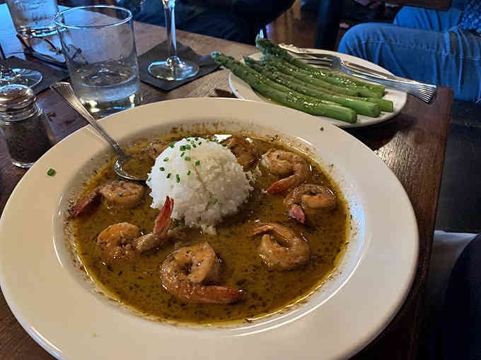 Perfectly seared fish rests alongside vibrant vegetables, demonstrating the kitchen's commitment to balancing flavors and textures with artistic precision.