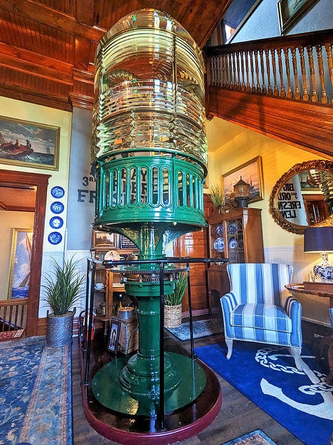 The magnificent Fresnel lens stands as a gleaming testament to maritime innovation, its intricate prisms catching and amplifying light beautifully.