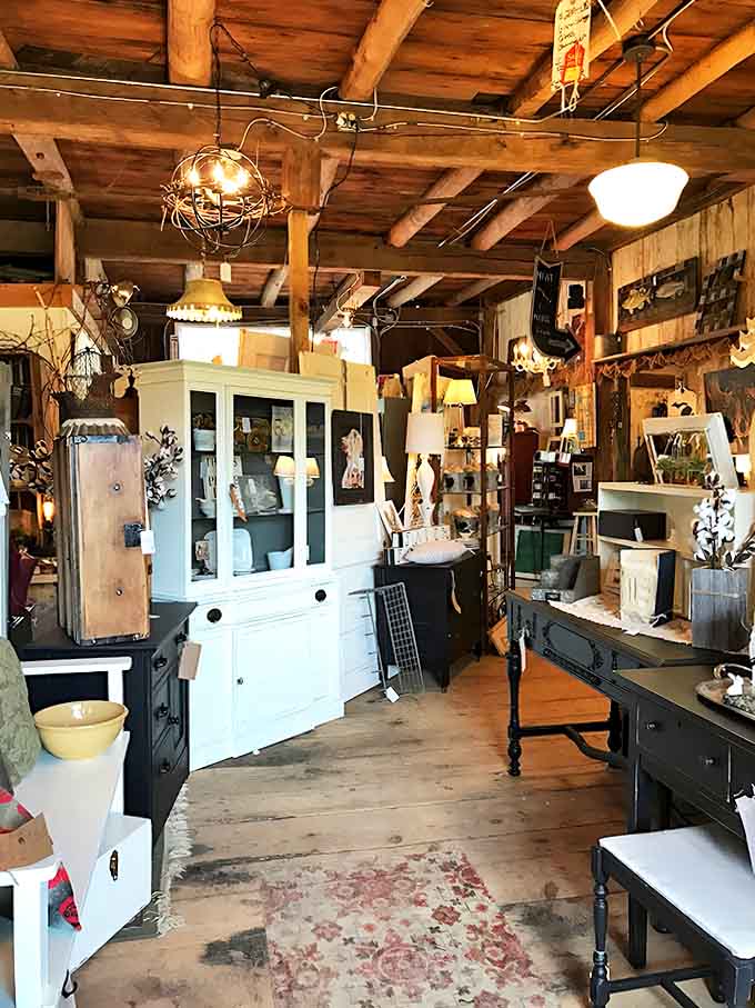 Painted furniture in soft hues creates a farmhouse aesthetic that's authentic, not the mass-produced kind you'd find elsewhere.