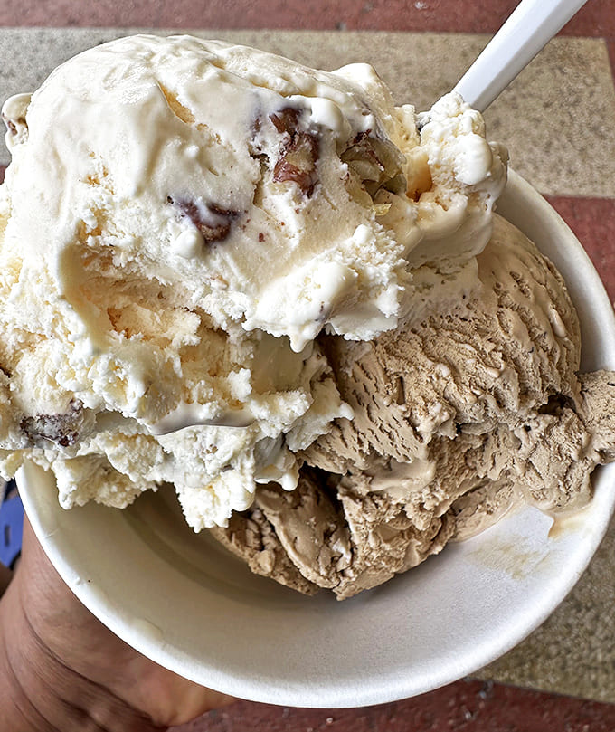 Three generous scoops proving that when it comes to ice cream, more is definitely more, and that's perfectly fine.